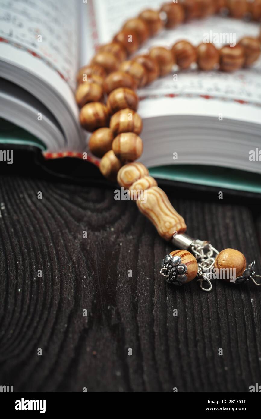 The Open holy Quran with tasbih rosary beads Stock Photo - Alamy