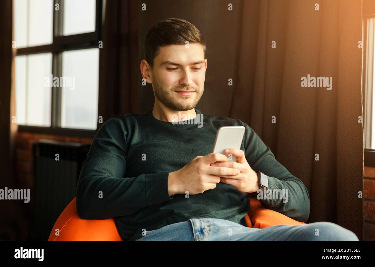 Phone game adult chair hi-res stock photography and images - Alamy