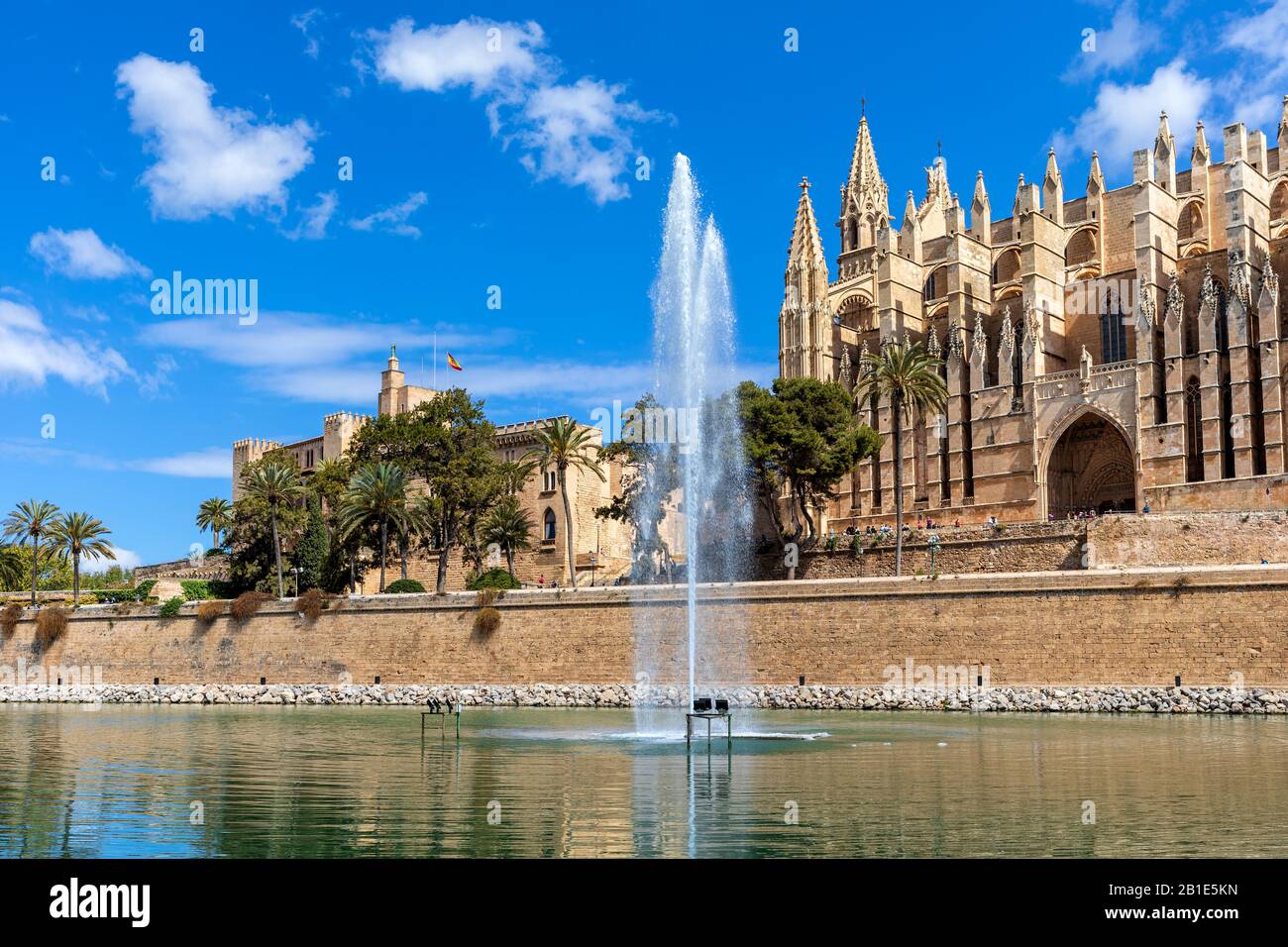Fountain and Palma Cathedral on background under blue sky in Palma de ...