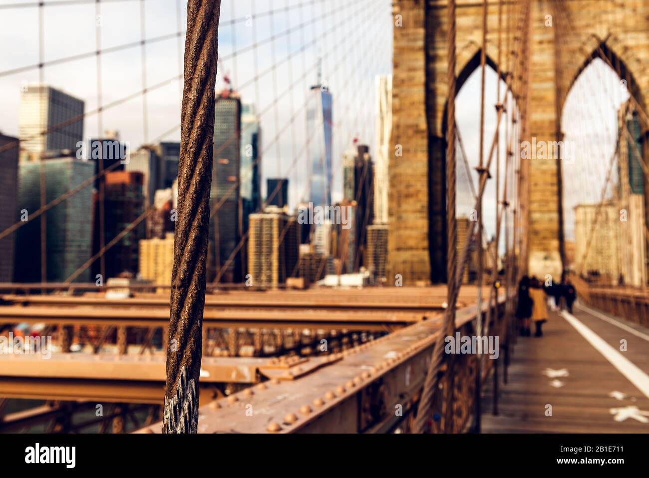 Details of the Brooklyn Bridge in New York City, USA. Toned in warm ...
