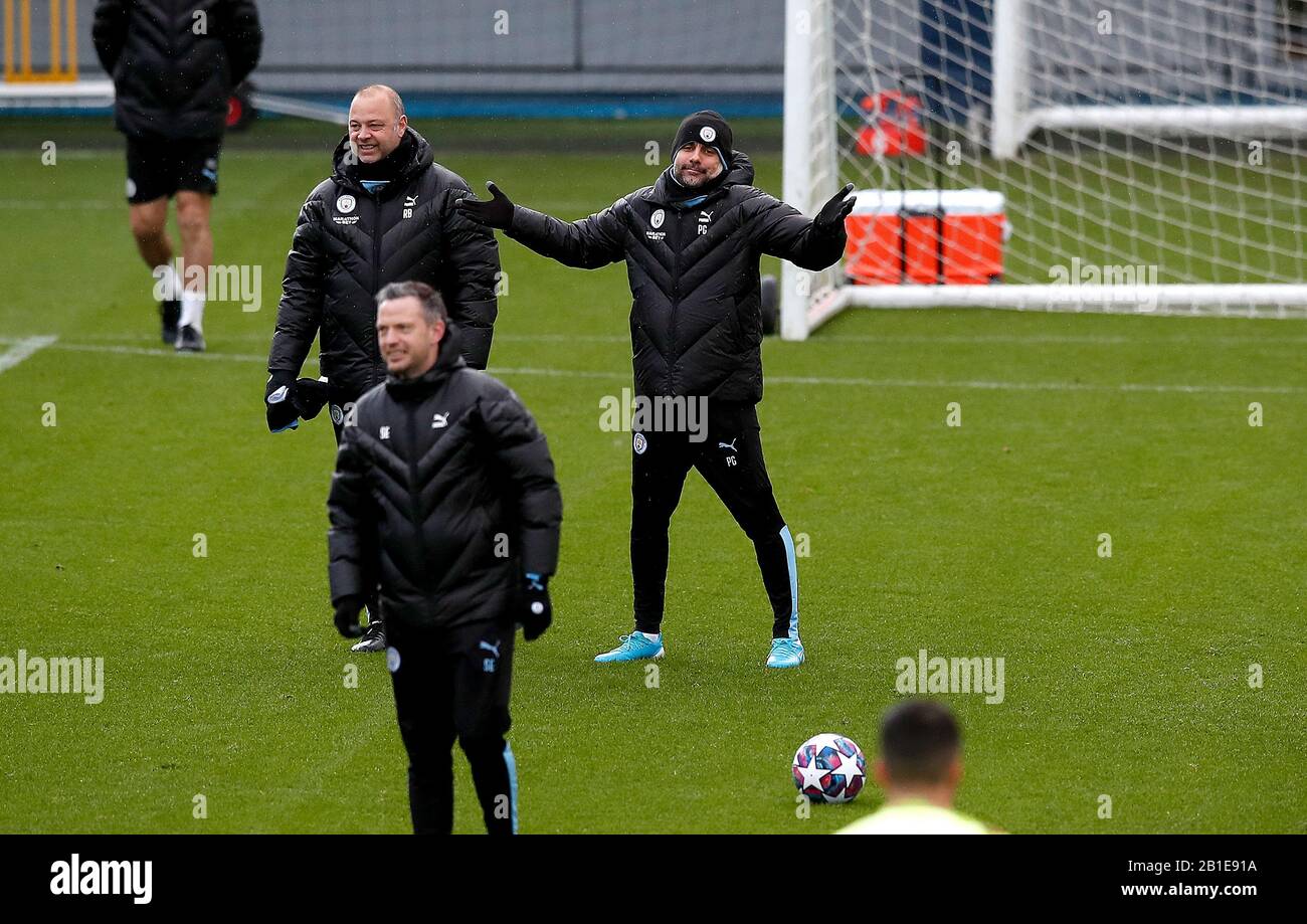 Manchester City's manager Pep Guardiola (right) during the training ...