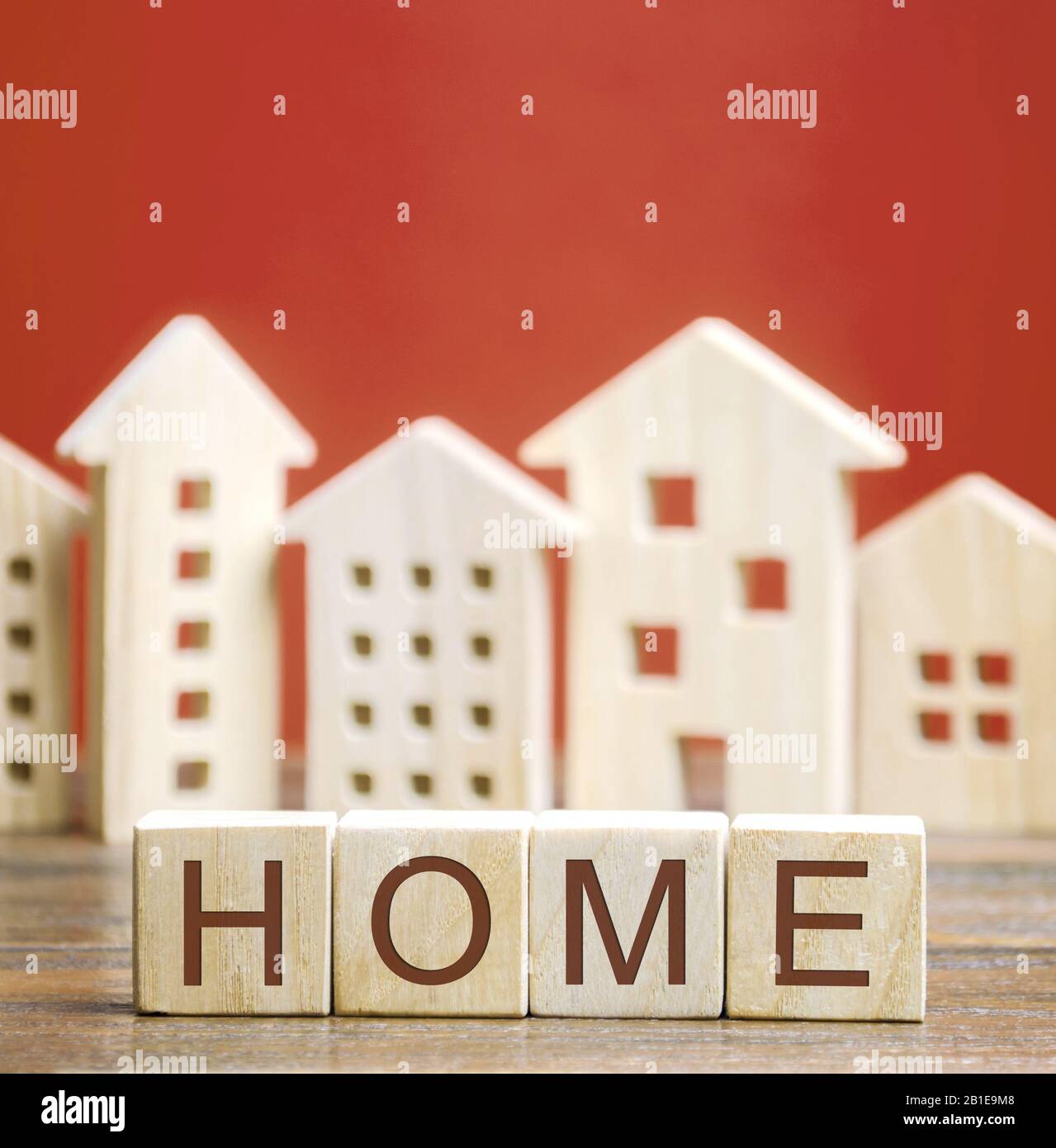 Wooden blocks with the word Home and miniature houses. " Sweet Home ...