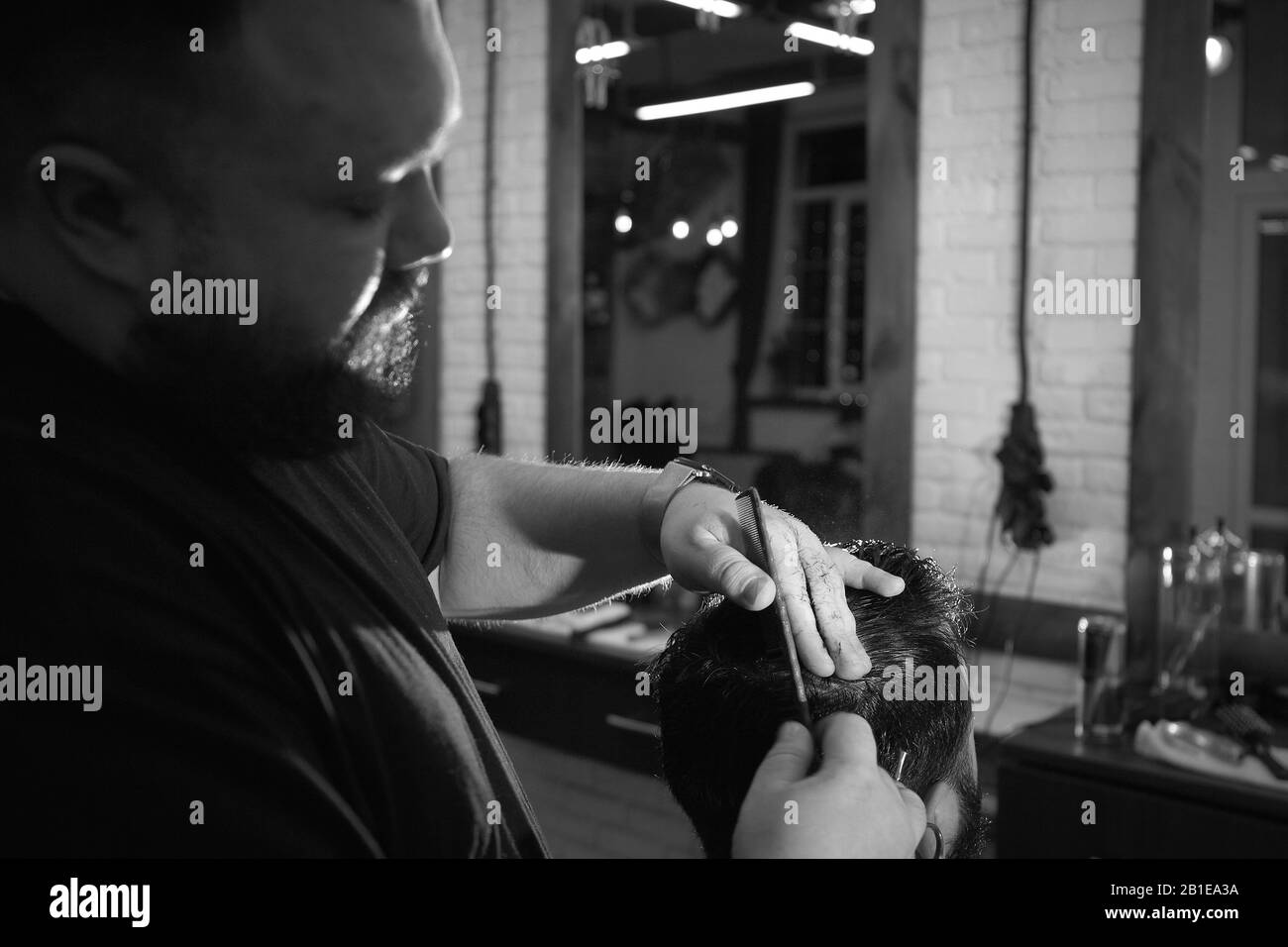 Male barber makes haircut electric hi-res stock photography and images ...