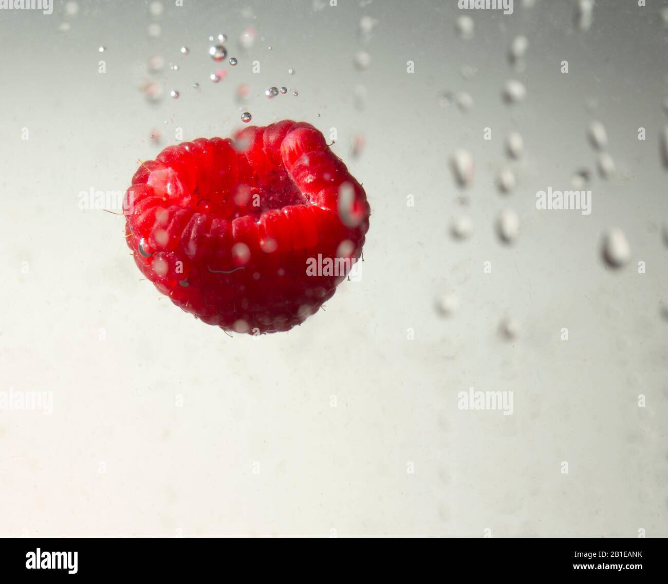 raspberry in water Stock Photo - Alamy