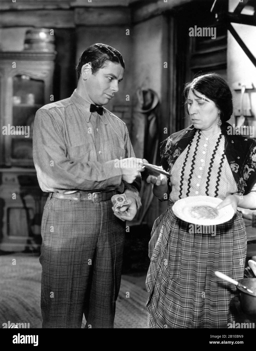 PAUL MUNI as Tony Camonte and INEZ PALANGE as Tony's mother in SCARFACE ...