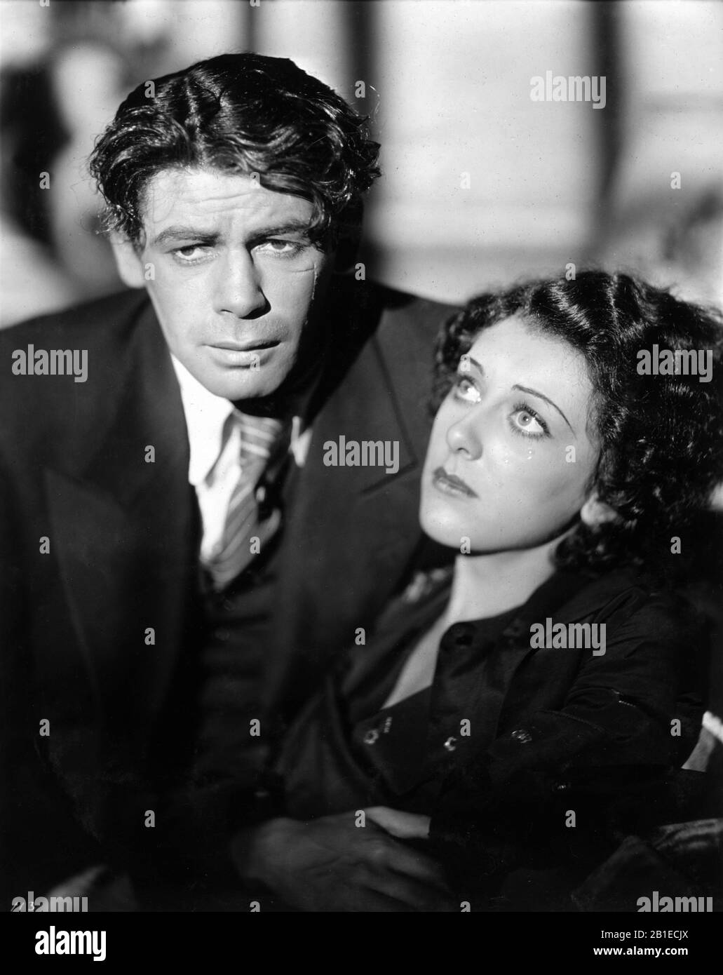 PAUL MUNI as Tony Camonte and ANN DVORAK as dying Cesca Camonte in ...