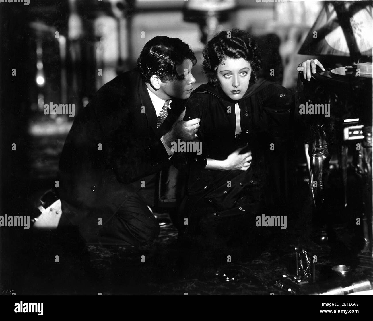 PAUL MUNI as Tony Camonte and ANN DVORAK as wounded Cesca Camonte in ...