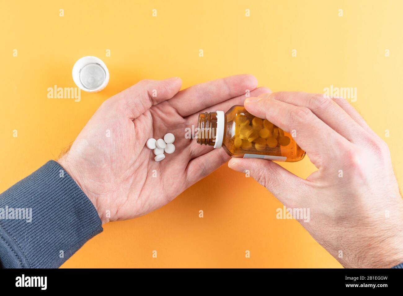 Person holding pill bottle hi-res stock photography and images - Alamy