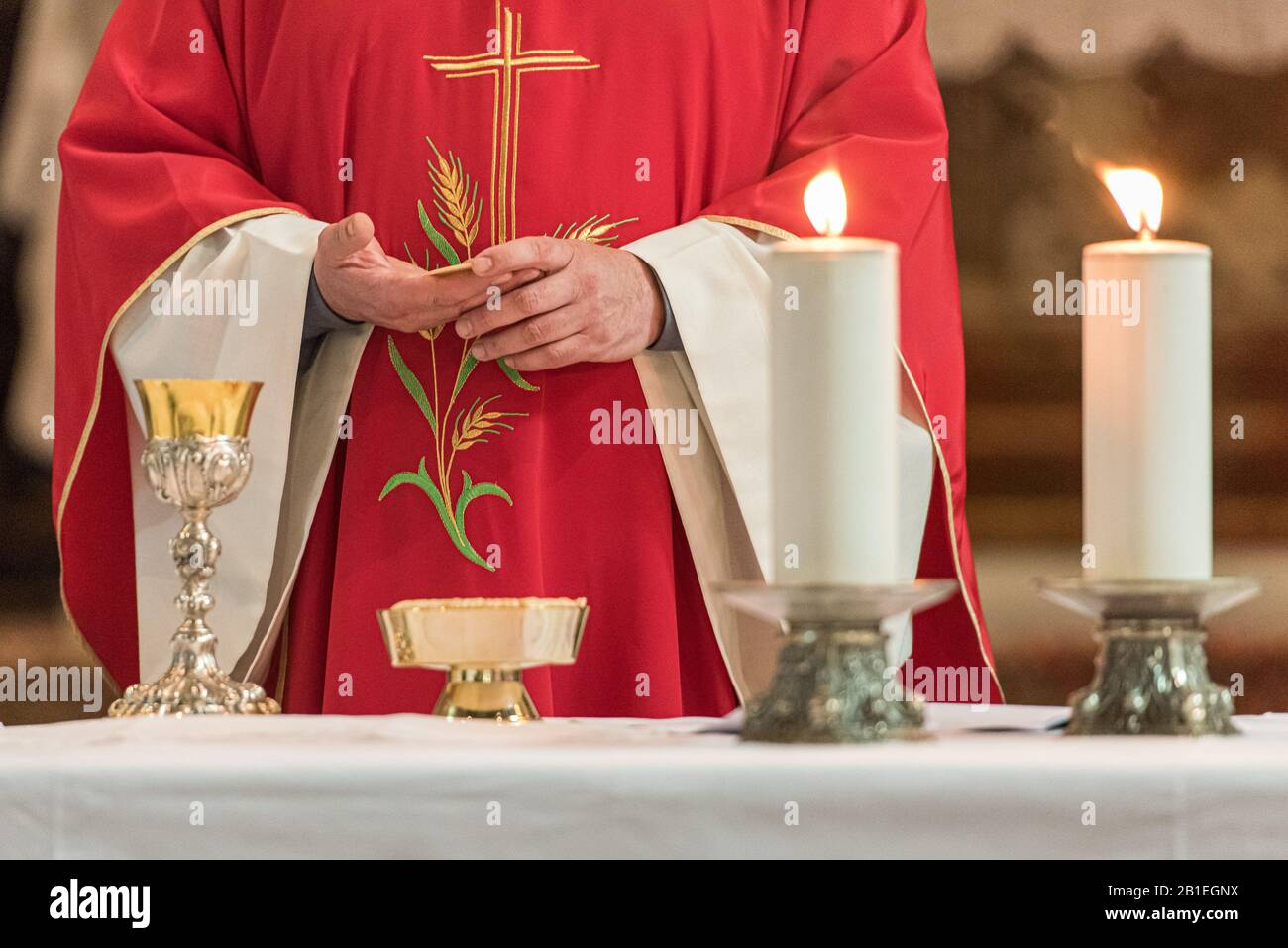 Minister showing the holy bread during the rite of the Holy Communion ...