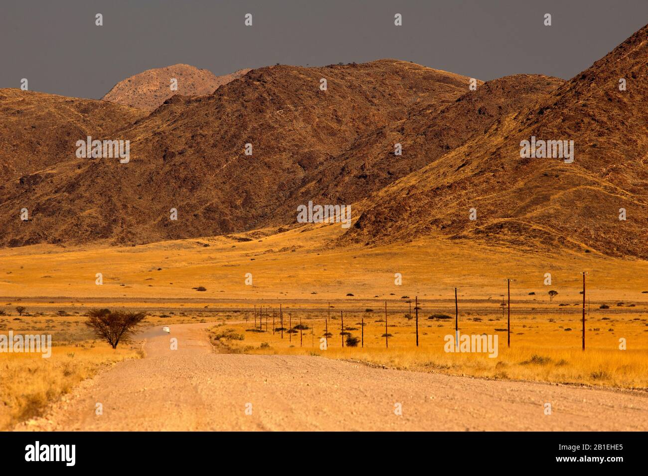 Rugged hills as seen from the gravel road on the way to Solitaire and ...