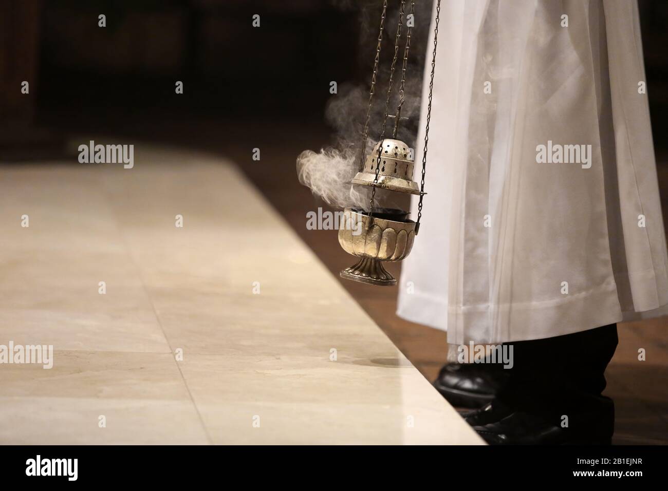 Incense during Mass at the altar and empty space for text Stock Photo ...