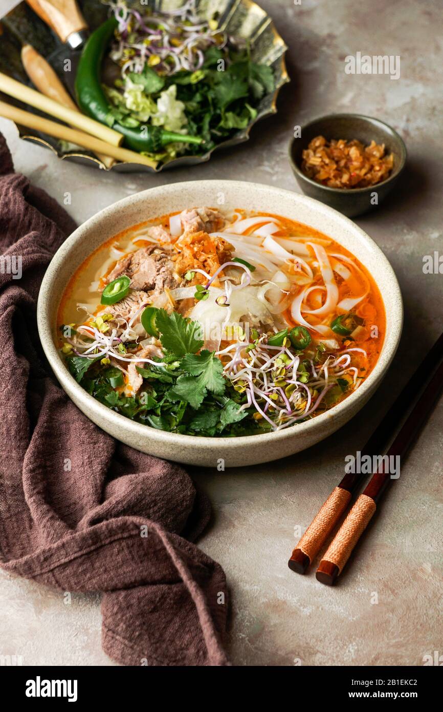 Bun Bo Hue, Bun Bo, Vietnamese beef noodle soup spicy. bowl of beef and ...