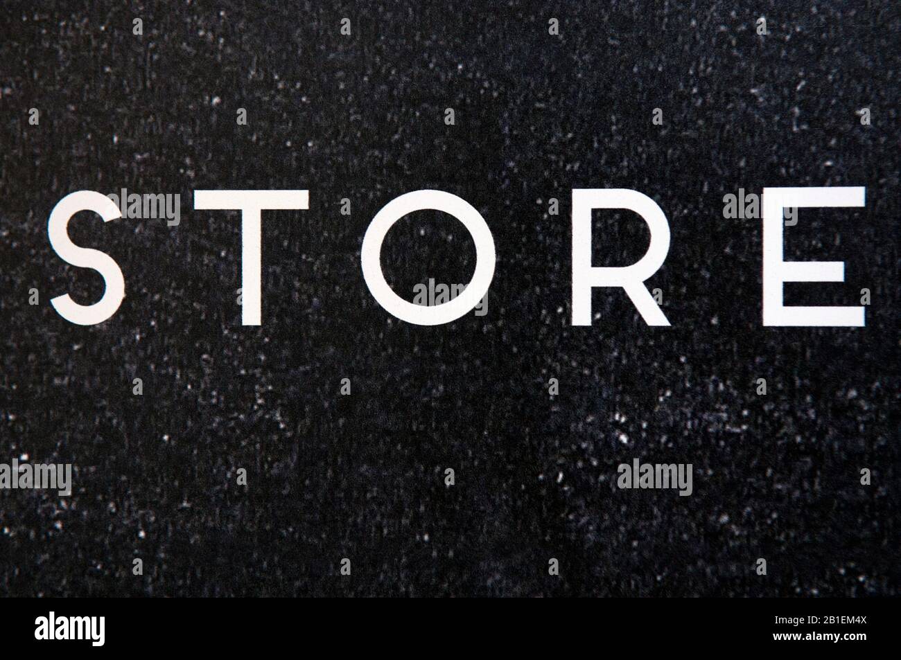 The Word Store Set Into The Exterior Stone Wall Of A Shop Stock Photo ...