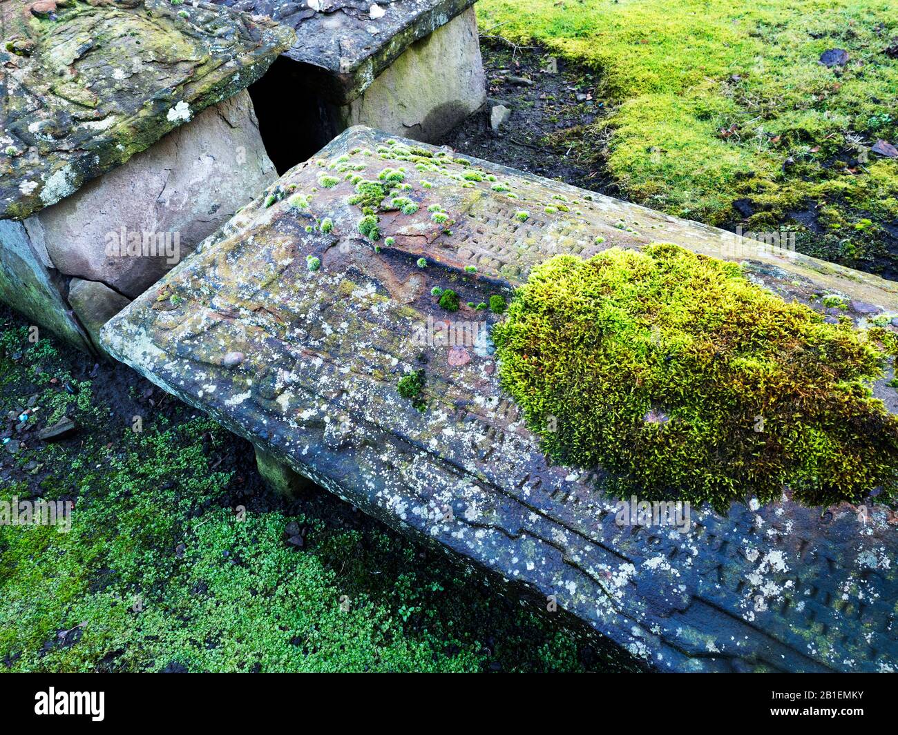 Old lichen and moss covered stone tomb in The Howff historic burial ...