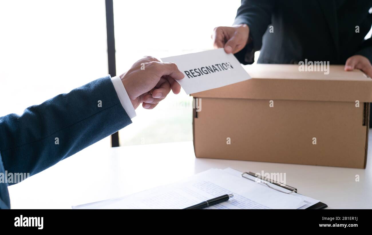 Employee businessman submit or sending resignation document letter to ...
