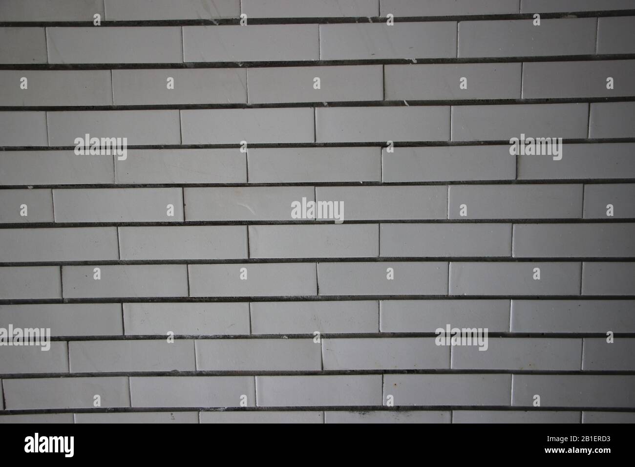 Light grey brick wall background surface pattern Stock Photo - Alamy