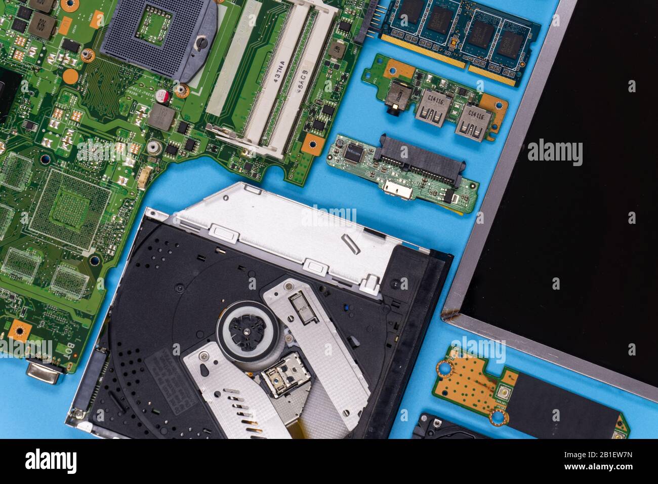 Parts of a modern computer. The insides of a laptop on a blue ...