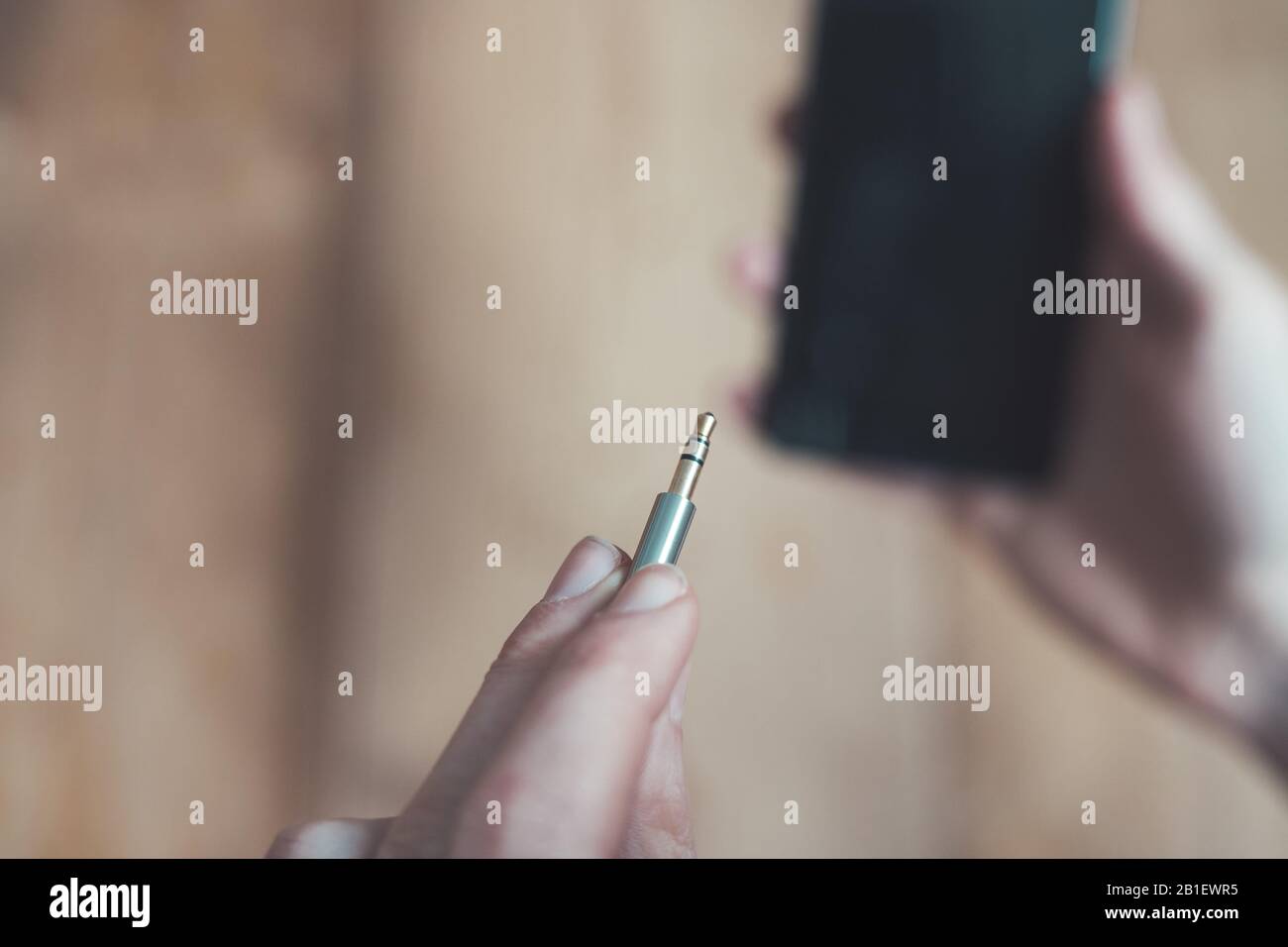 3 5mm audio jack into a phone hi-res stock photography and images - Alamy