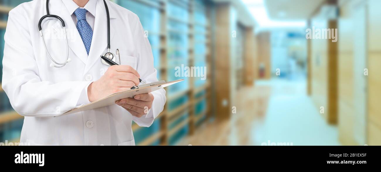 Cropped shot of a male doctor holding a medical chart at the hospital ...