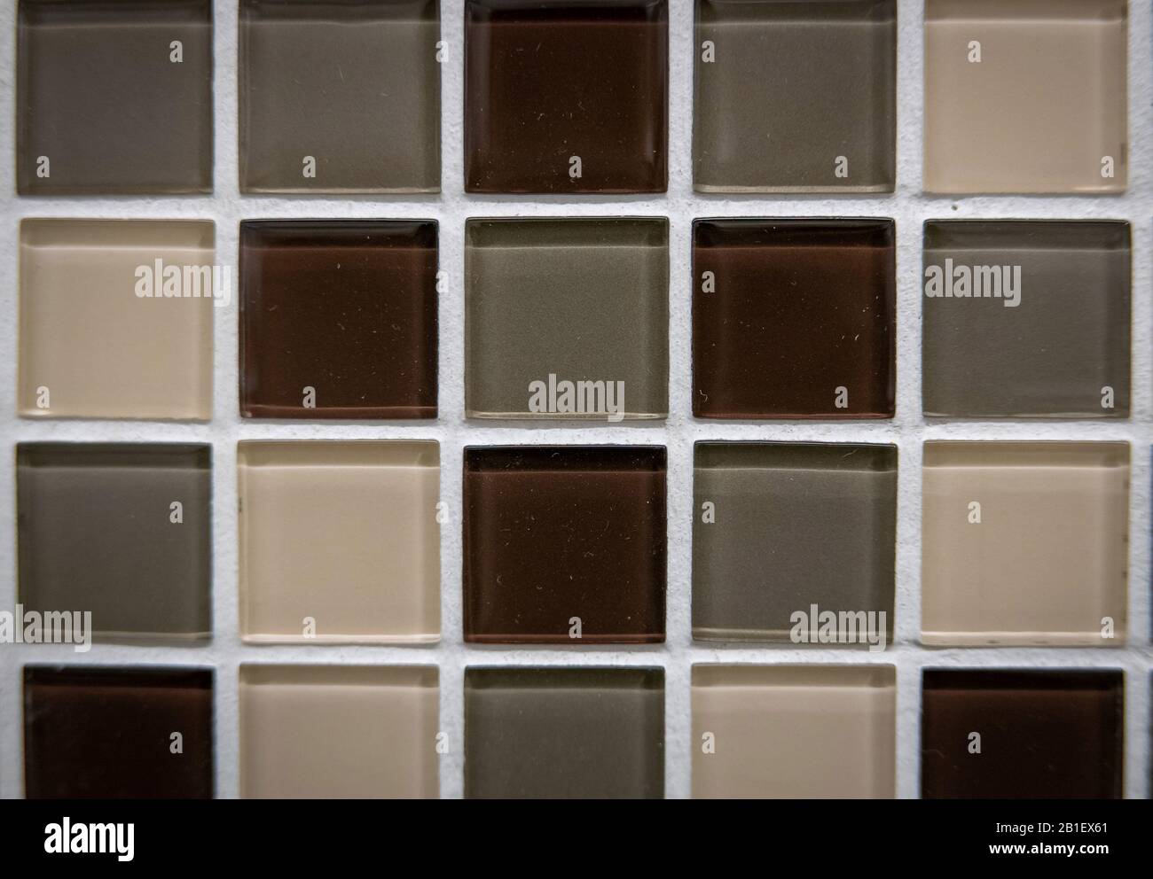 Brown ceramic mosaic on the wall as background Stock Photo - Alamy