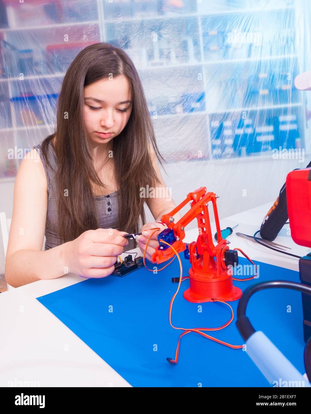 Schoolgirl in the classroom design and development of robots Stock ...