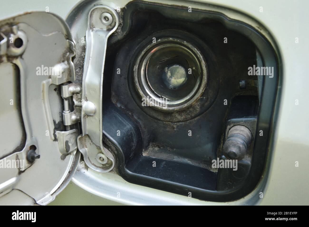 car fuel tank cap opened in parking Stock Photo - Alamy