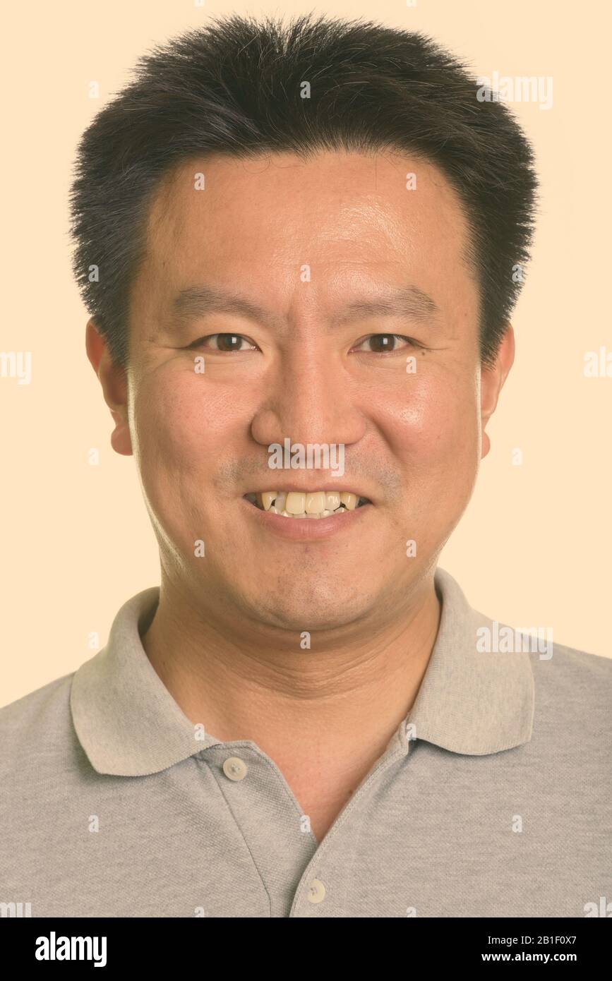Studio shot of mature handsome Japanese man Stock Photo - Alamy