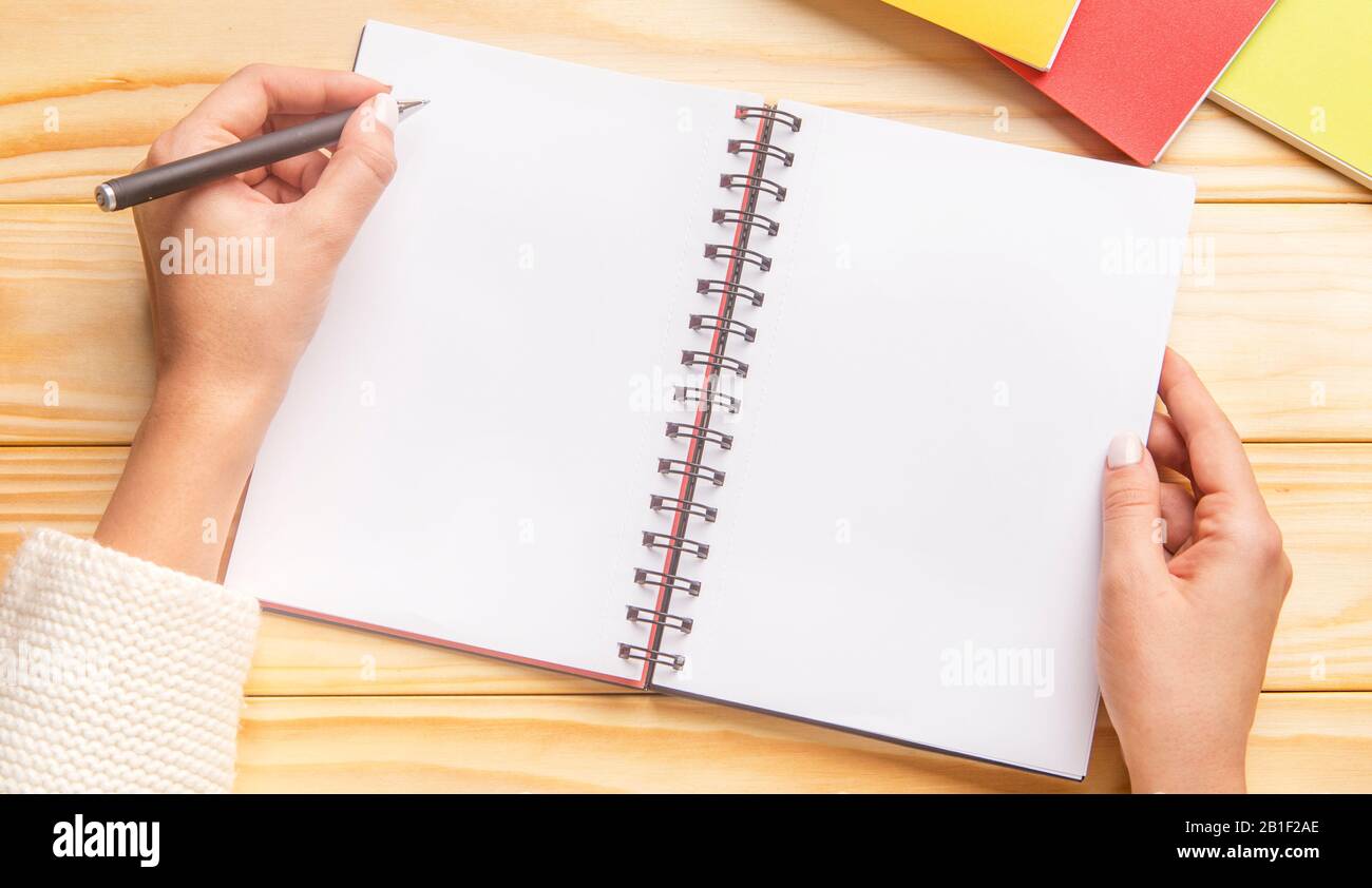Female hands writing in a notebook tasks and goals for work Stock Photo ...