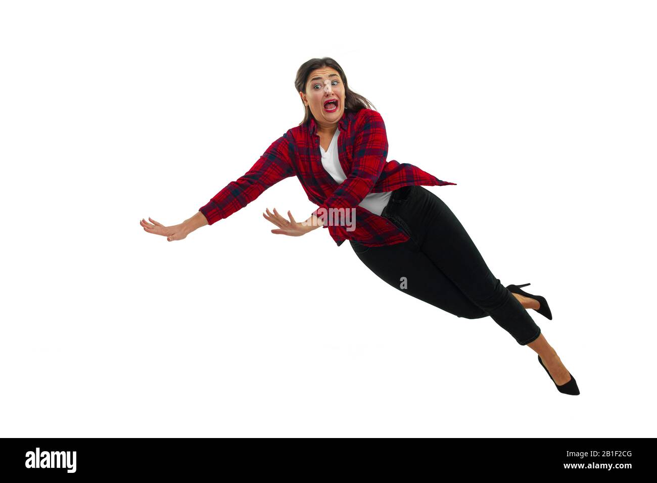 A second before falling. Caucasian young girl falling down in moment ...