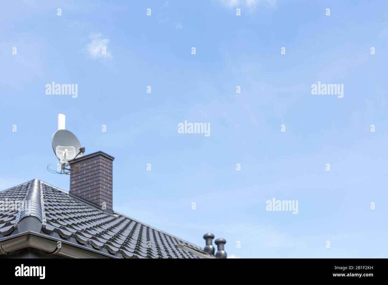 roof of the new modern house with gutter, ventilation chimney and ...