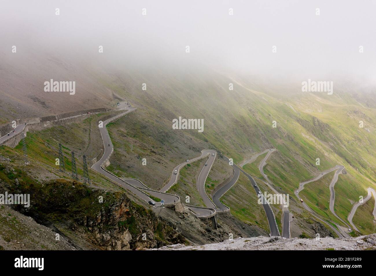 Crazy epic switchback mountain road Stelvio Italy cycling in the clouds ...