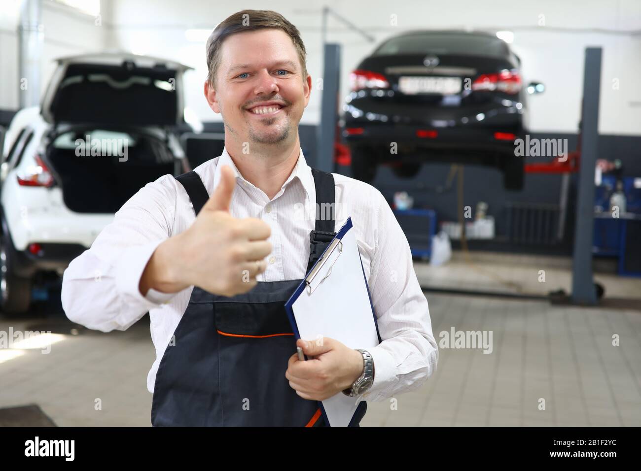 Happy young man at work Stock Photo - Alamy
