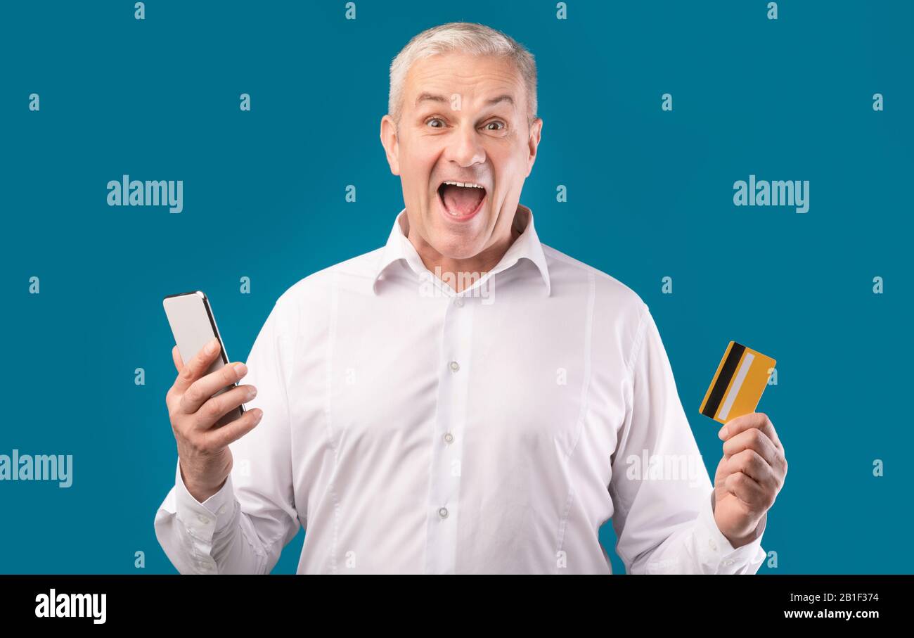 Mature man using debit card hi-res stock photography and images - Alamy