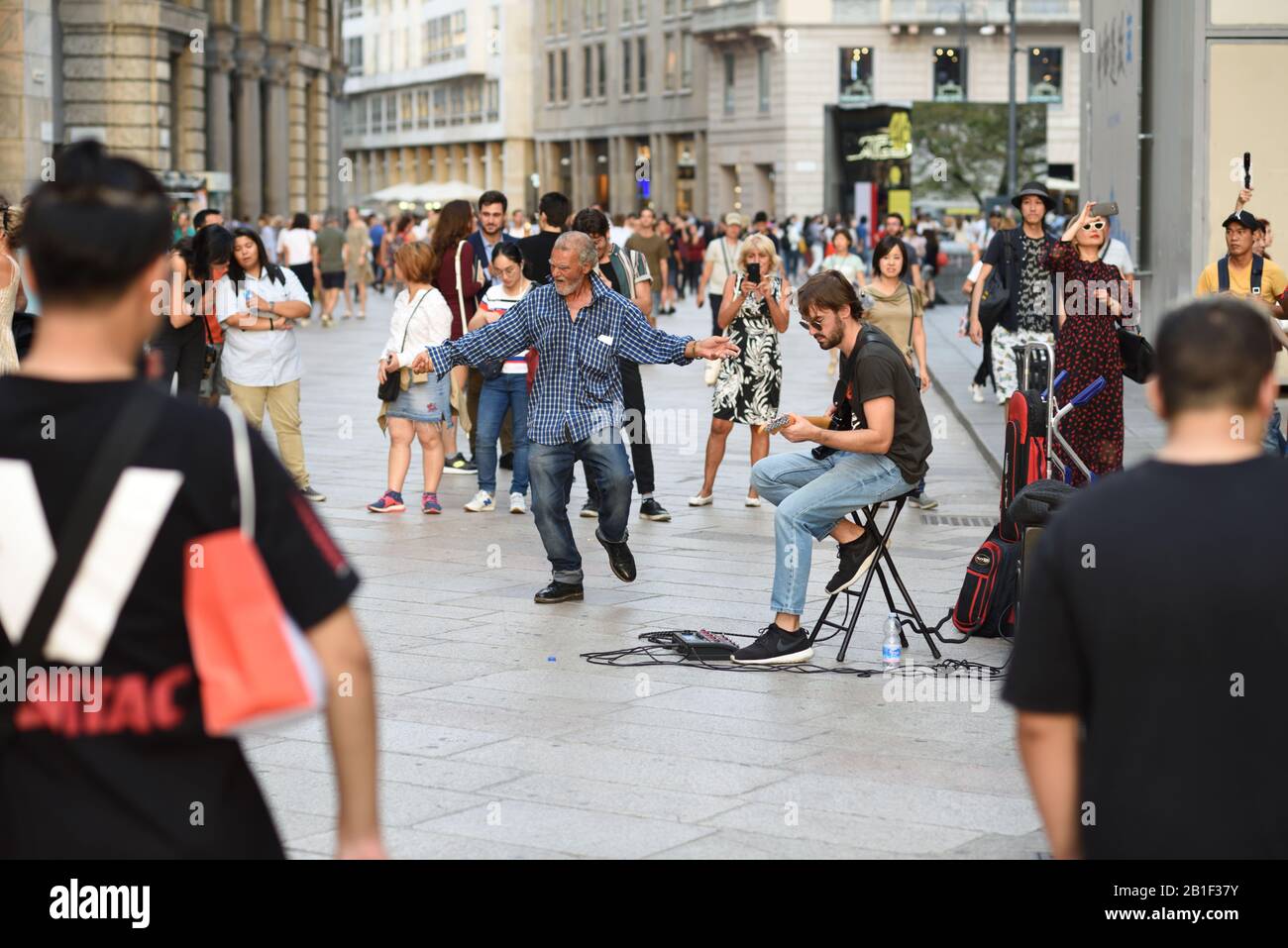 Dancing in the street like nobody's watching, in a crowd of people ...