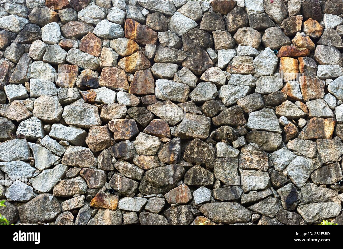 Natural stone masonry wall texture or background Stock Photo - Alamy