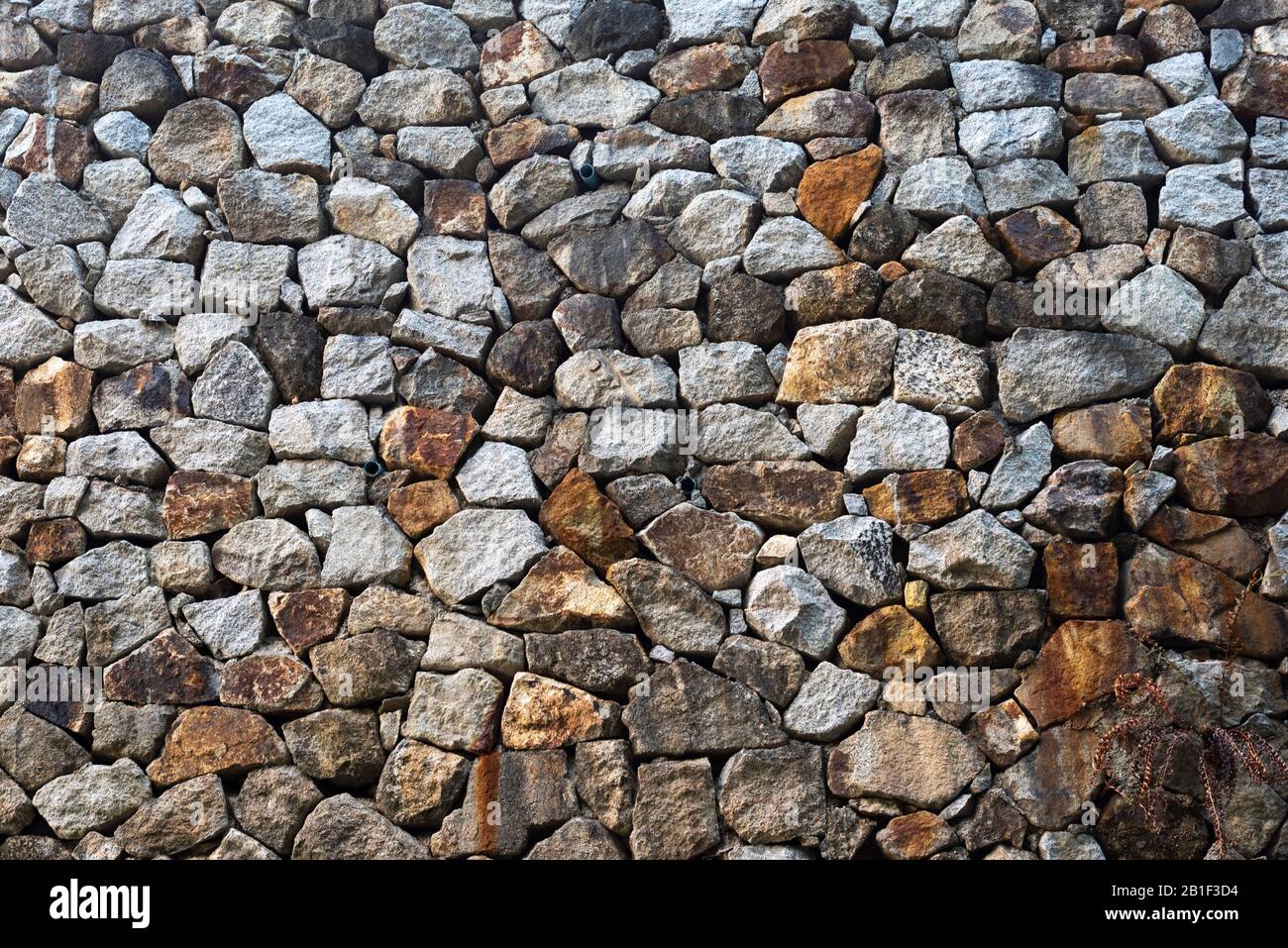 Natural stone masonry wall texture or background Stock Photo - Alamy