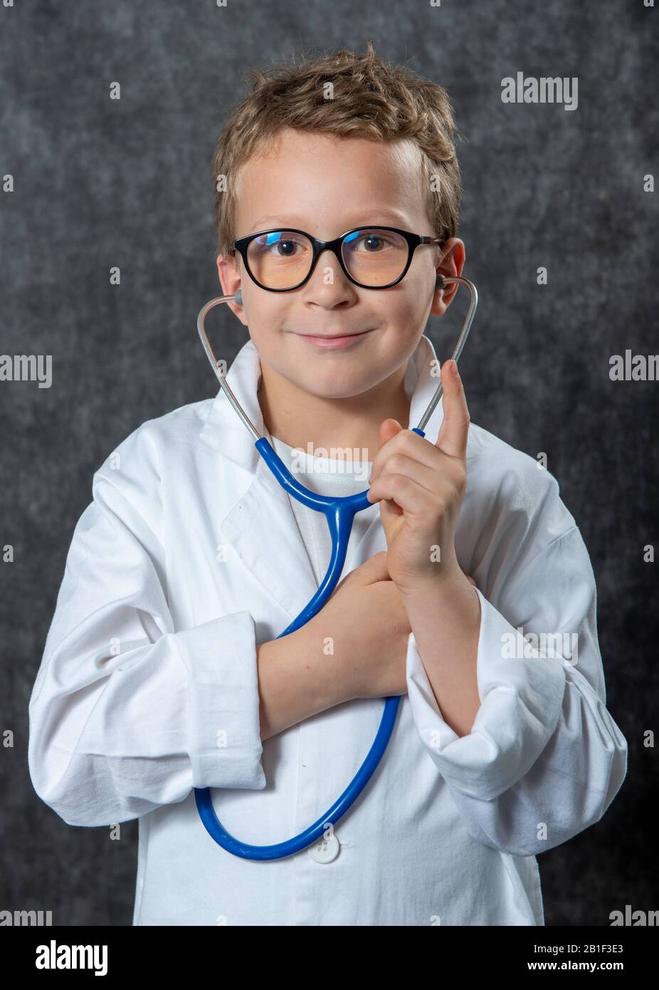 Cute kid boy wear medical uniform playing doctor, a portrait Stock ...