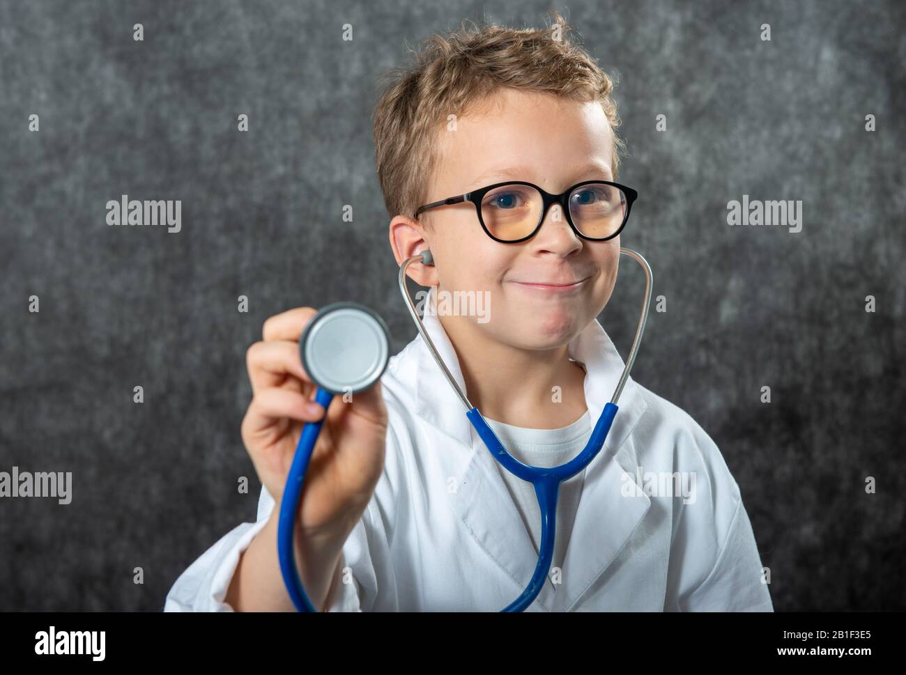 Cute kid boy wear medical uniform playing doctor, a portrait Stock ...