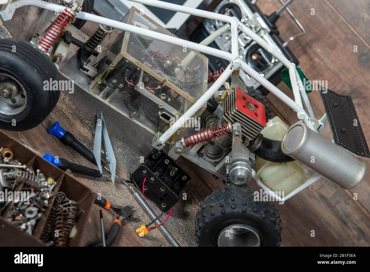 Radio-controlled car model with the tools for repairing rc buggy models ...