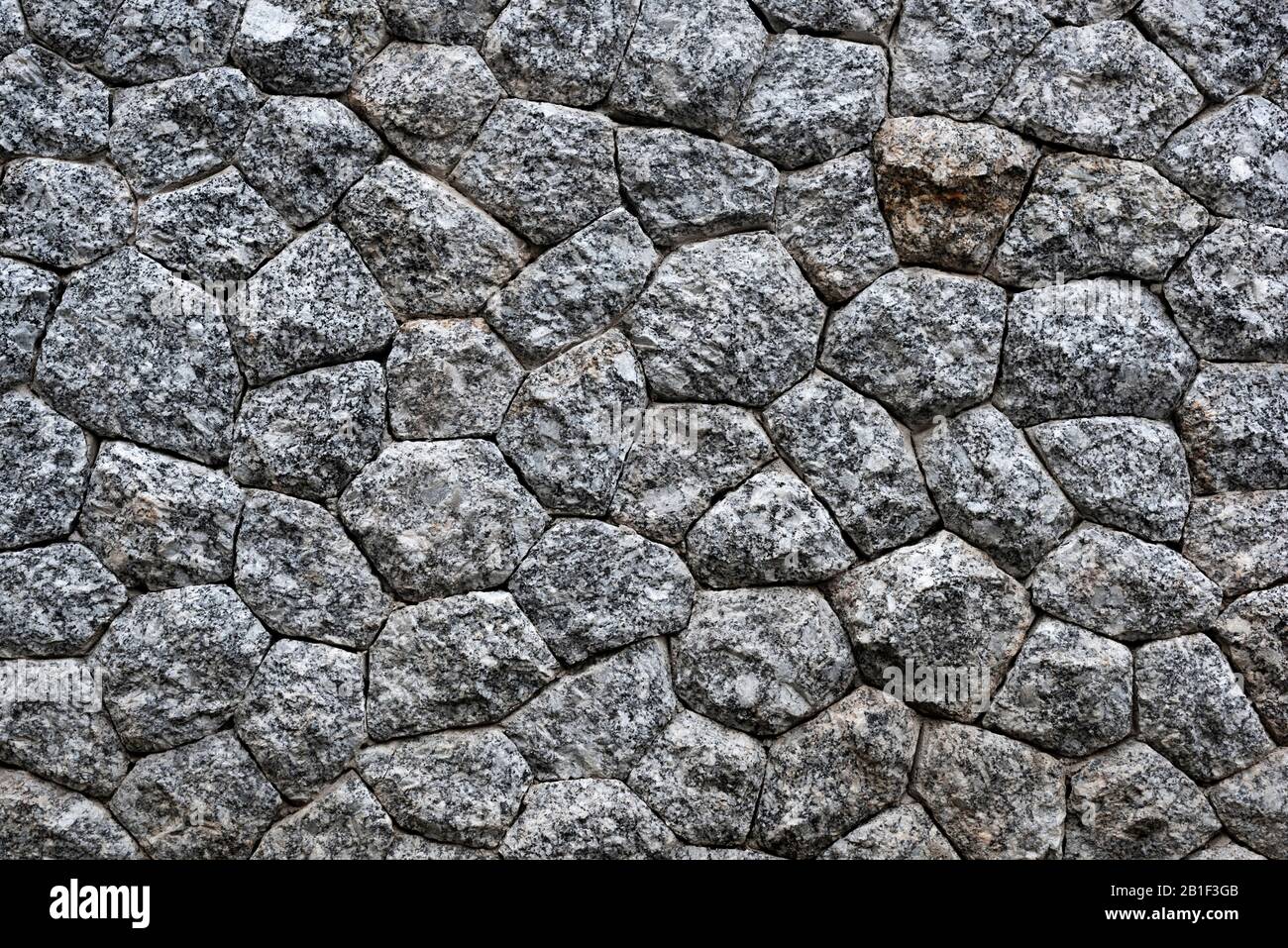 Natural stone masonry wall texture or background Stock Photo - Alamy