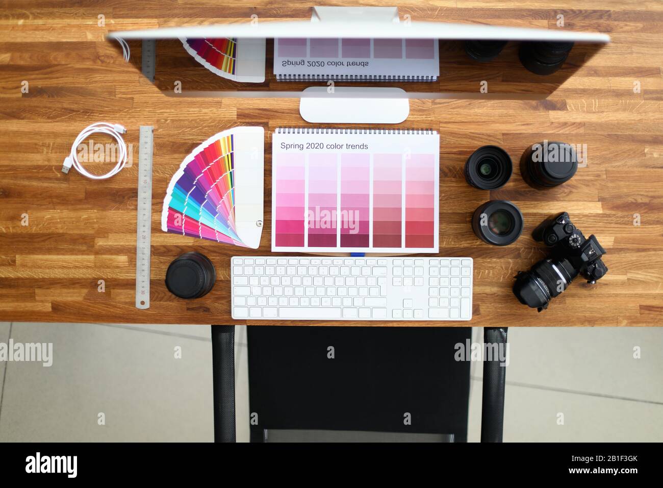 Photographers desk, camera and color palette Stock Photo - Alamy