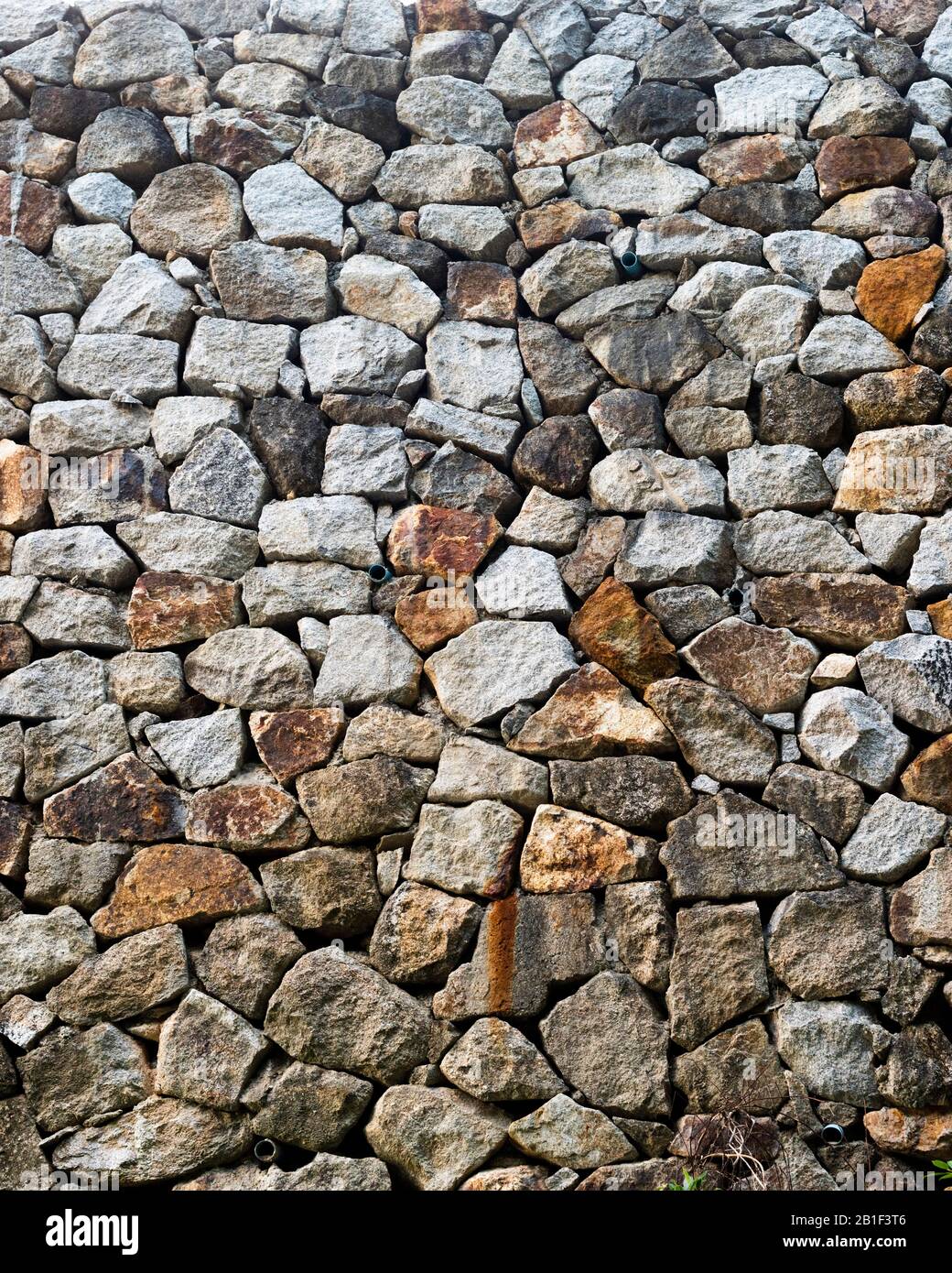 Natural stone masonry wall texture or background Stock Photo - Alamy
