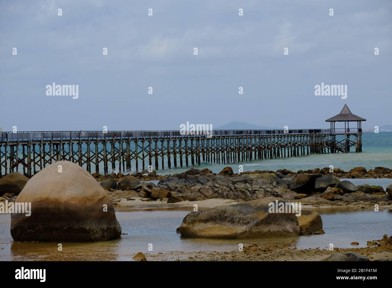 Batam Indonesia - Jetty at Nongsa Beach during low tide Stock Photo - Alamy