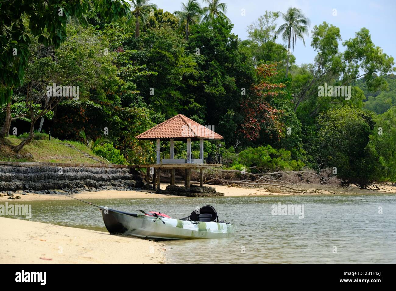 Batam Indonesia - Nongsa River bank with fishing kayak Stock Photo - Alamy