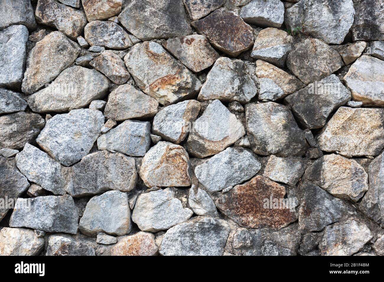 Natural stone masonry wall texture or background Stock Photo - Alamy