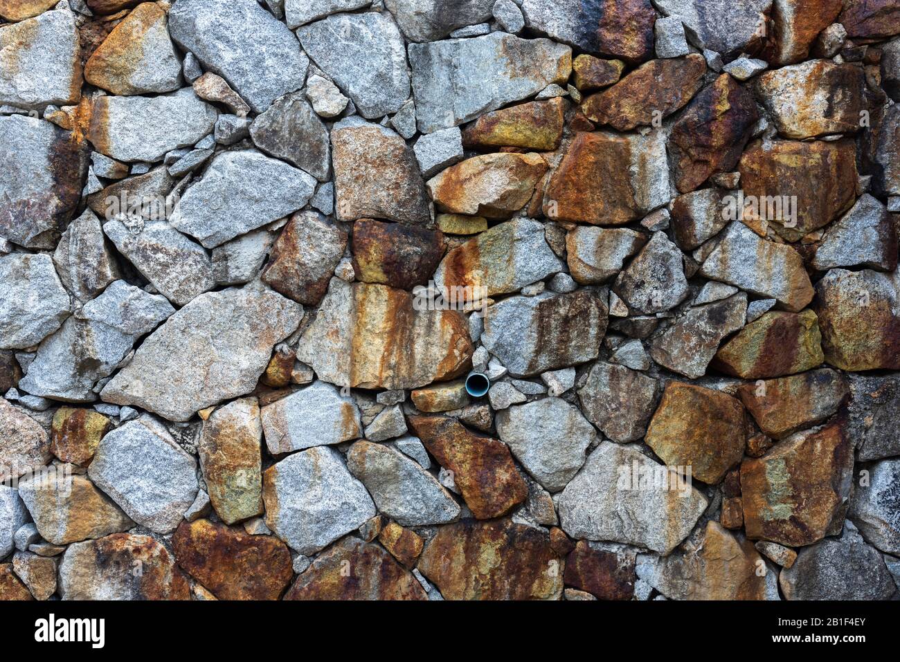 Natural stone masonry wall texture or background Stock Photo - Alamy
