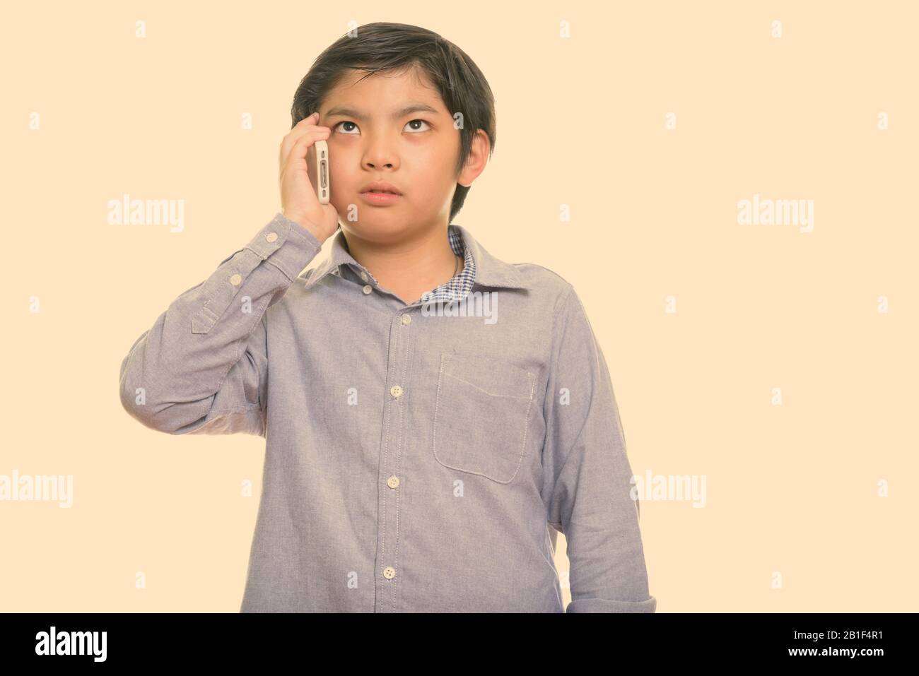 Boy talking on mobile hi-res stock photography and images - Alamy