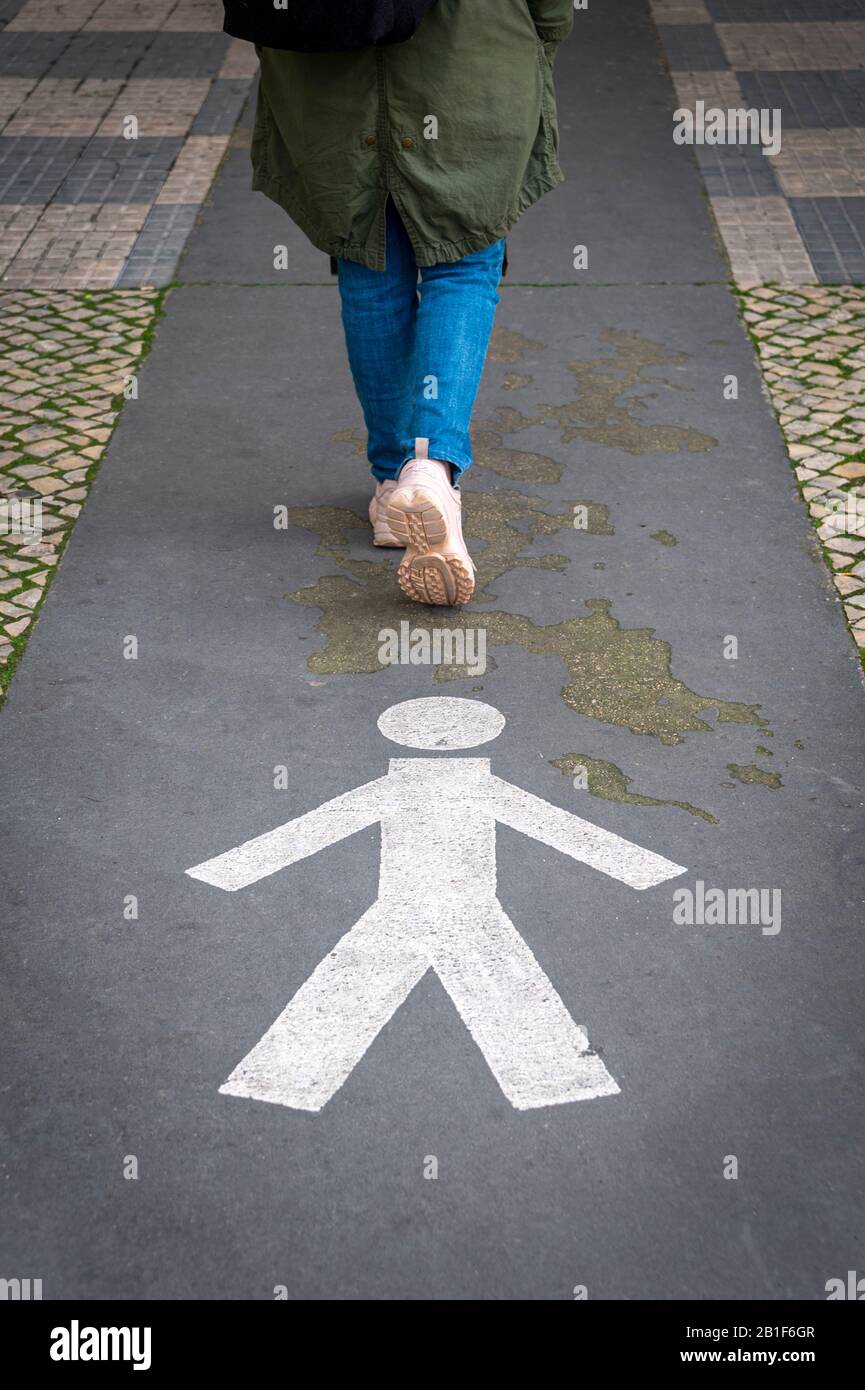 pedestrian walkway with painted symbol Stock Photo - Alamy