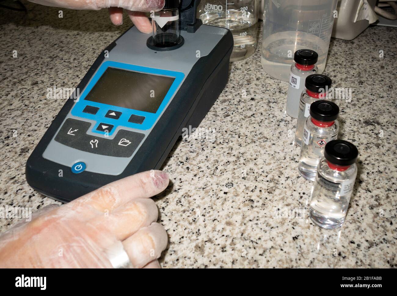 Working with machines to analyze samples in a laboratory Stock Photo ...