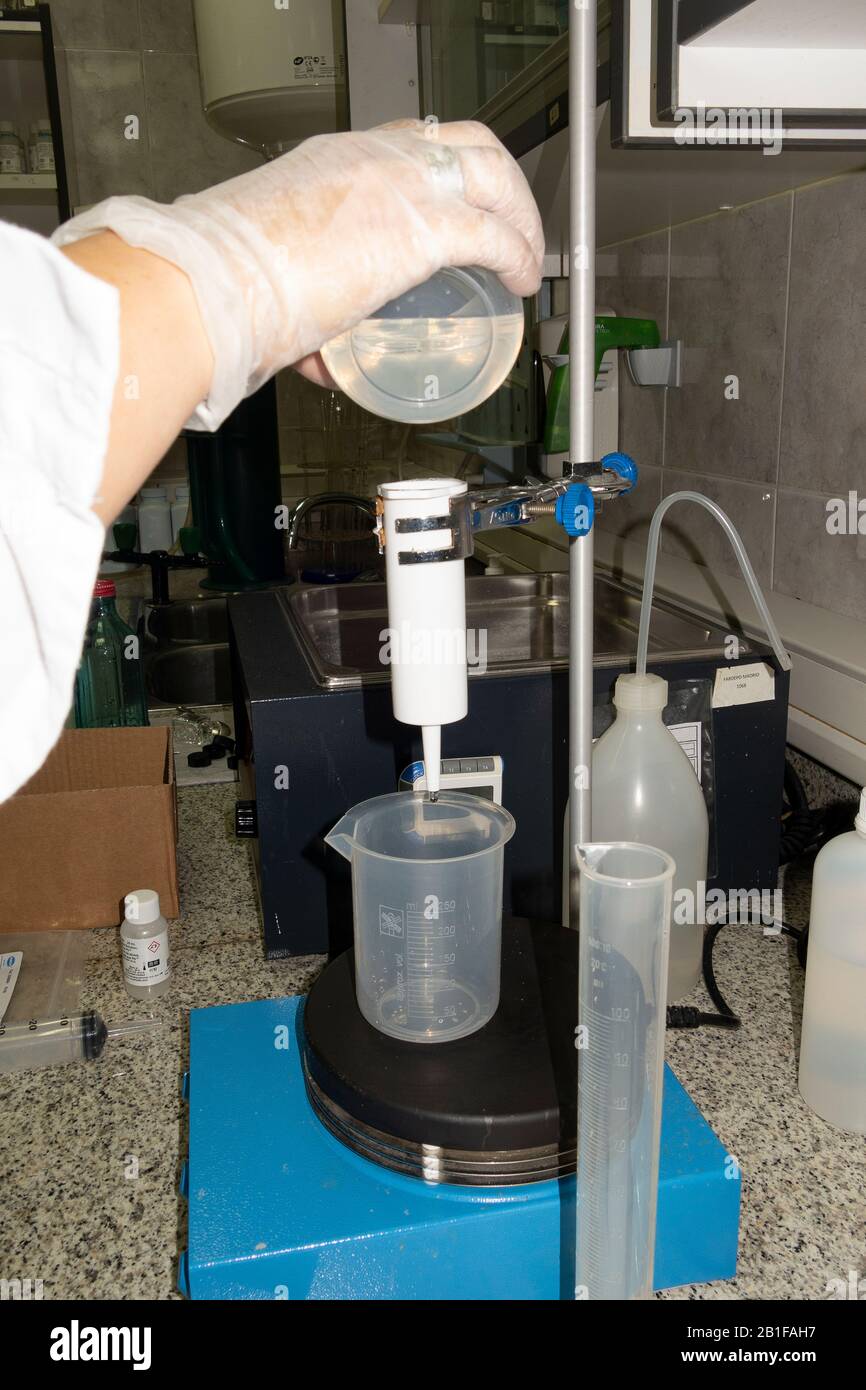 Working with machines to analyze samples in a laboratory Stock Photo ...